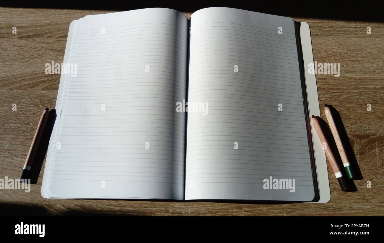 U-turn notebook with blank white pages. To the left and right of the ...