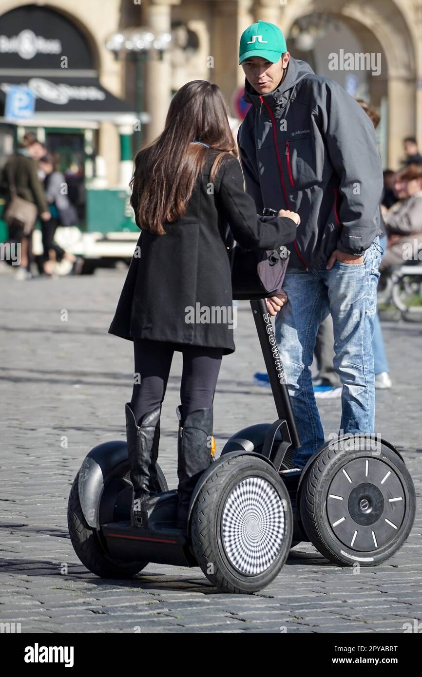 Two young people enjoying Segways in Prague Stock Photo - Alamy