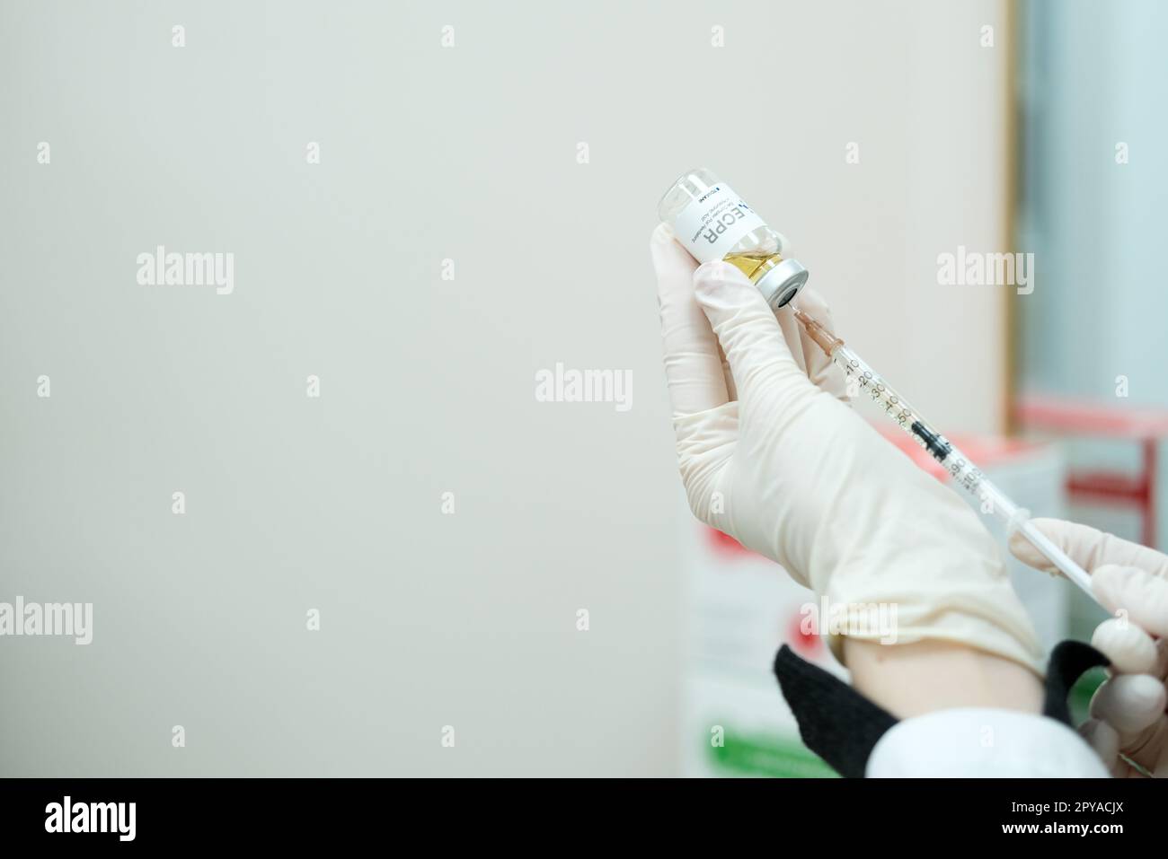Cosmetologist putting eye mesotherapy serum on syringe Stock Photo - Alamy