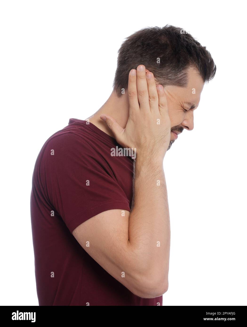 Man suffering from ear pain on white background Stock Photo - Alamy