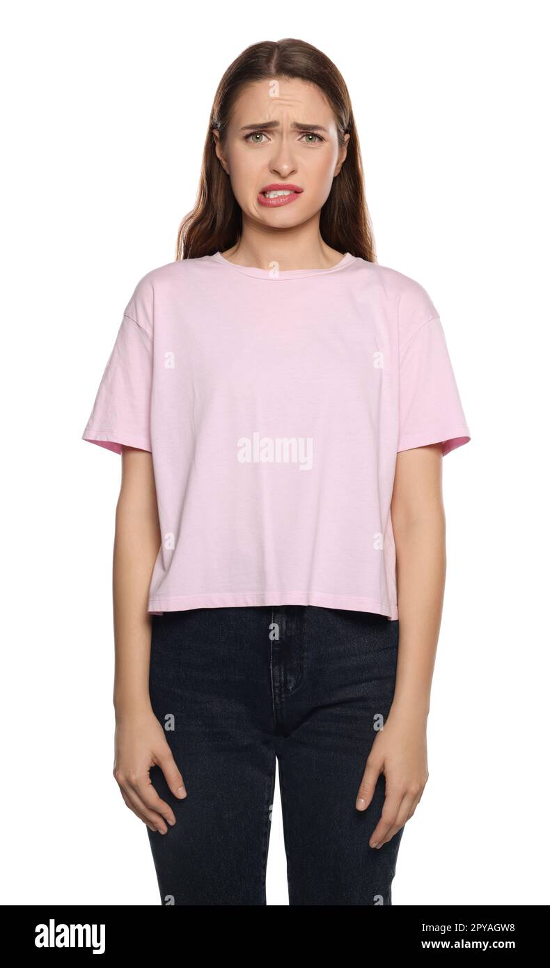 Embarrassed young woman in shirt on white background Stock Photo - Alamy