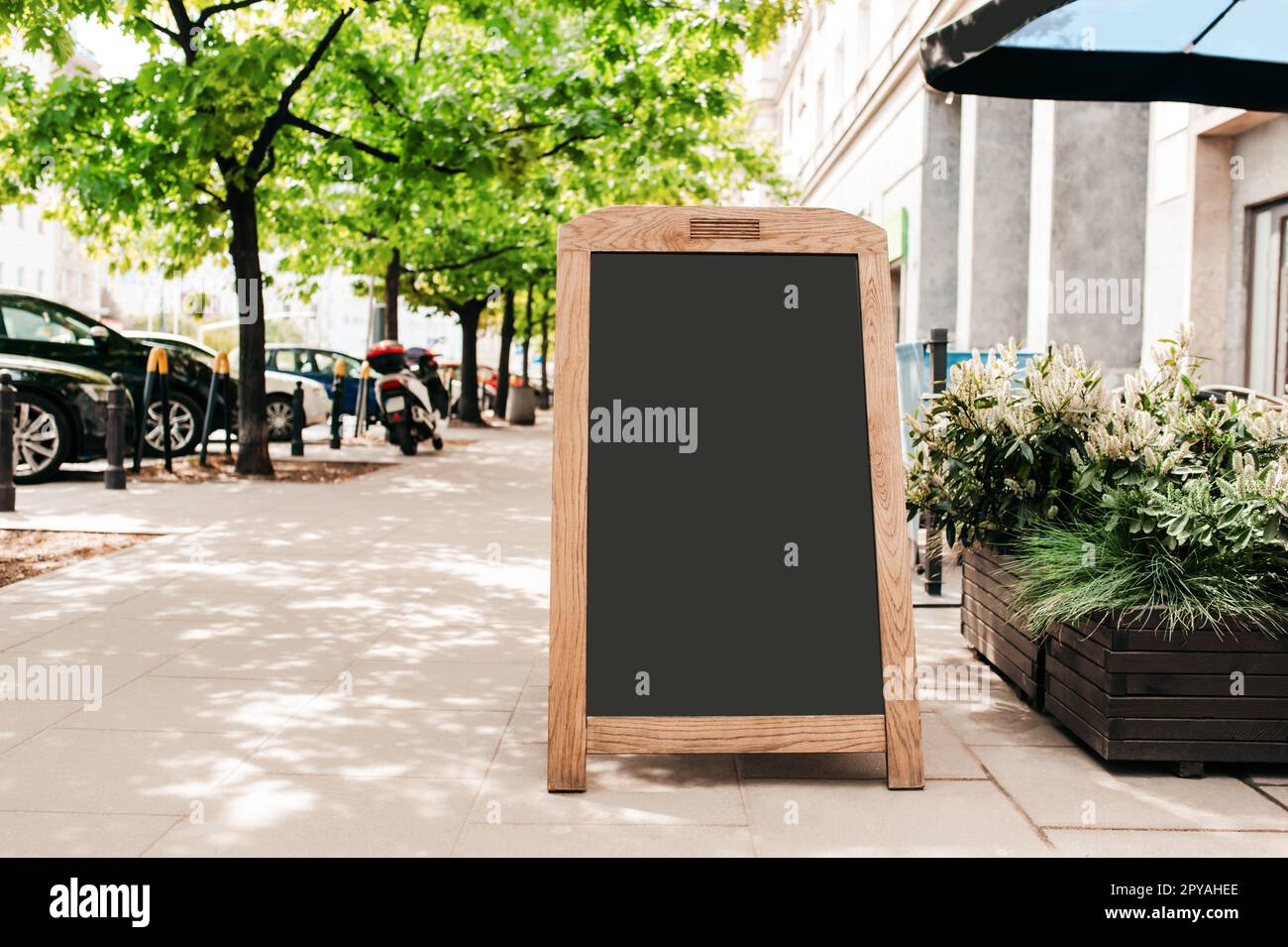 Blank advertising board on city street. Space for design Stock Photo ...