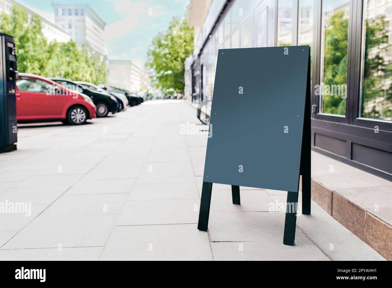 Blank advertising board on city street. Space for design Stock Photo ...