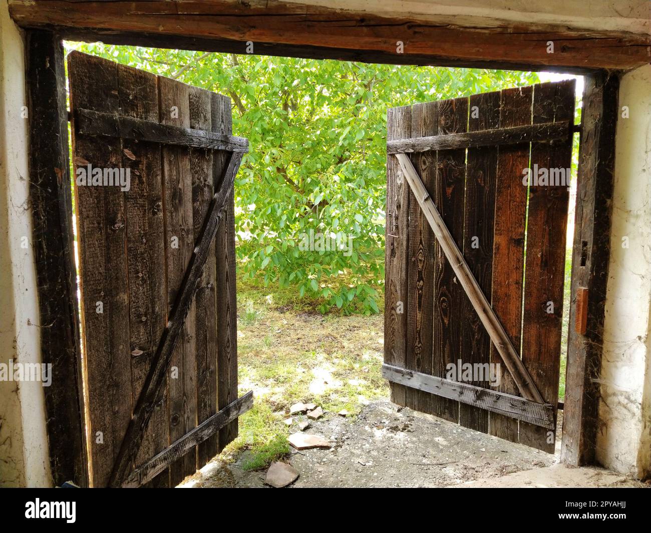 Beautiful old wooden open door. Inside view of the room. Crib doors ...