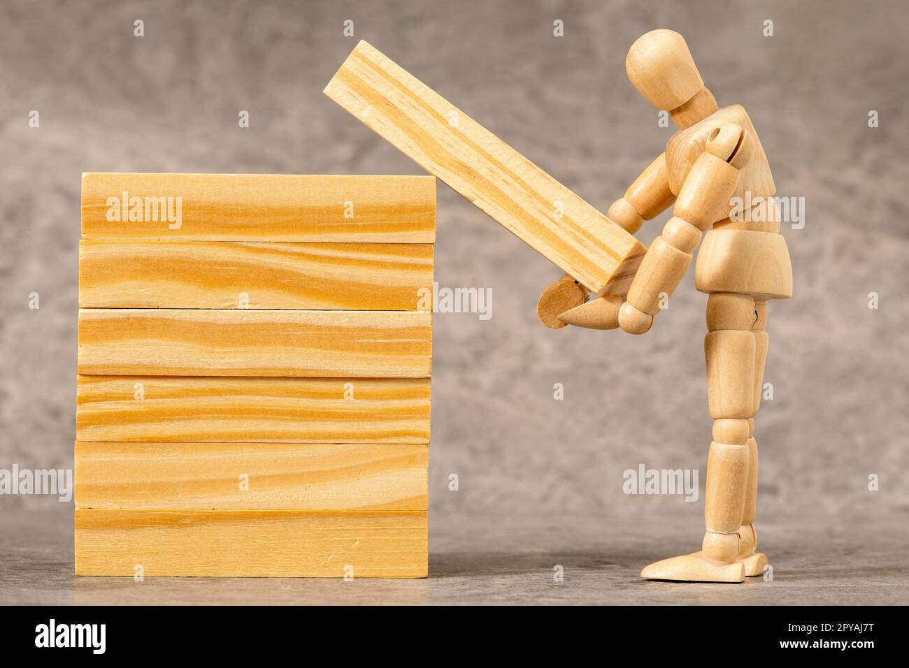 Dummy placing wood block on the tower, plan and strategy in business ...