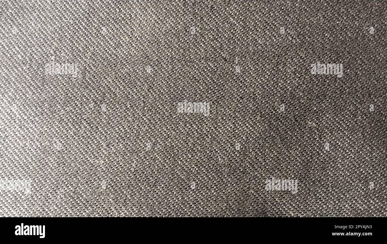 Gray fabric close-up. Weaving of individual threads. Knitted polyester ...