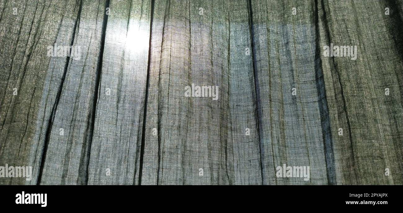 the sun is visible through the gray pleated curtains. Scandinavian ...