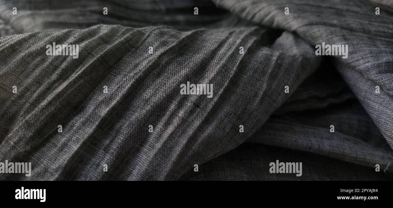 Gray pleated fabric or crumpled textile closeup. Light translucent ...