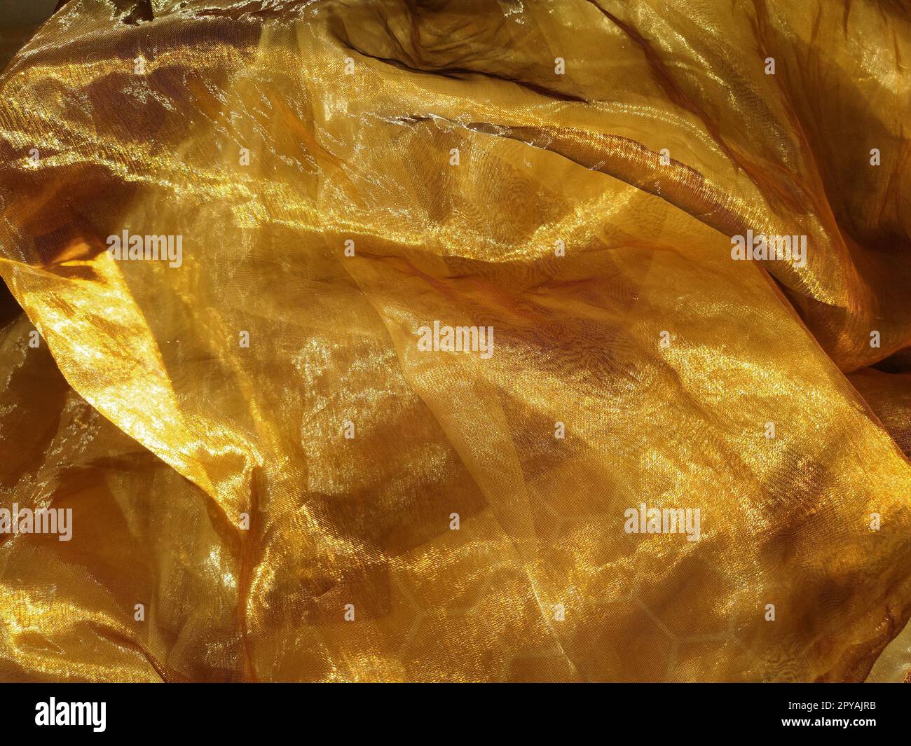 Organza is yellow-brown with a beige sheen. Shiny, reflective ...
