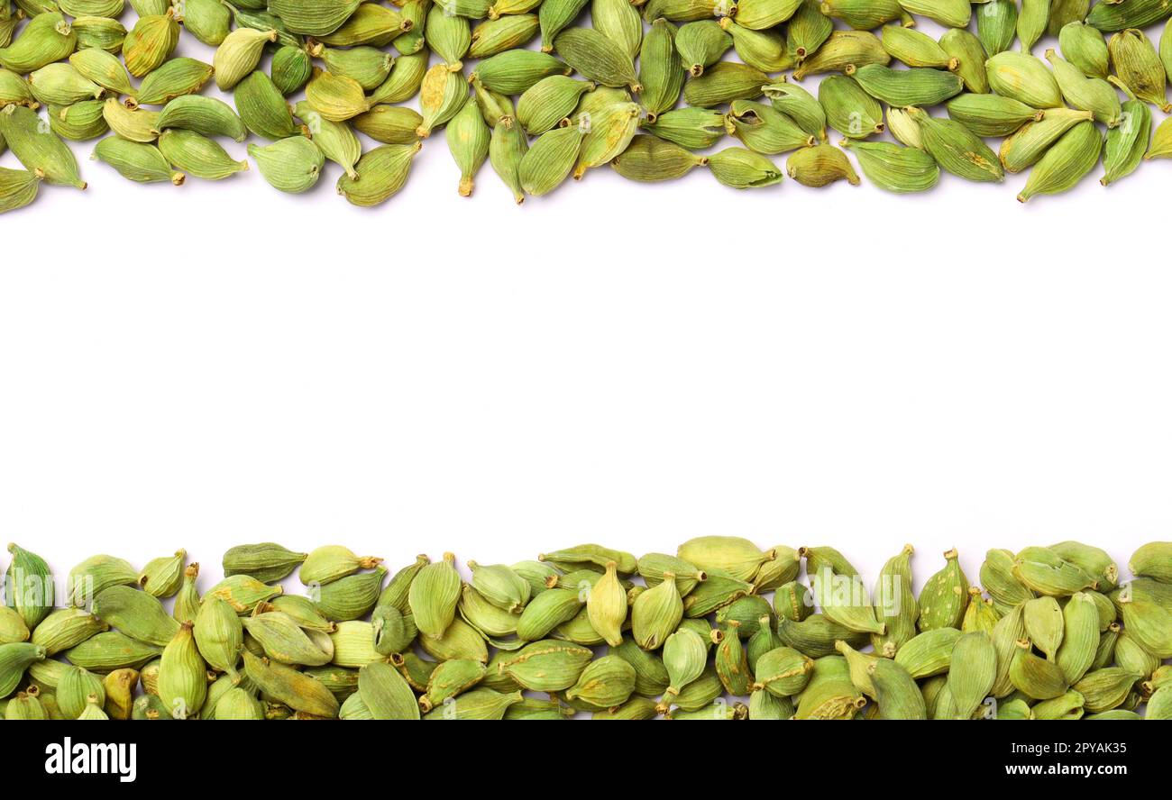 Dry green cardamom pods on white background, flat lay. Space for text ...