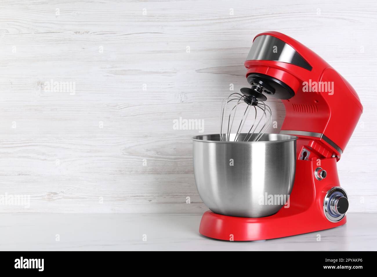 Modern red stand mixer on white marble table, space for text Stock ...