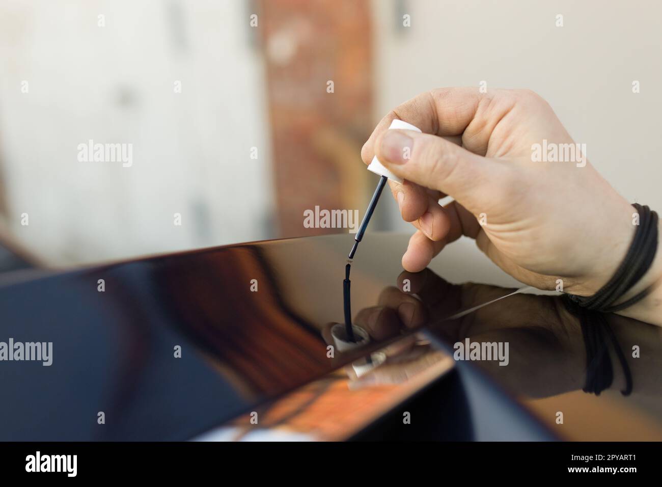 Brush painting small scratches chipped car vehicle detailing paint ...