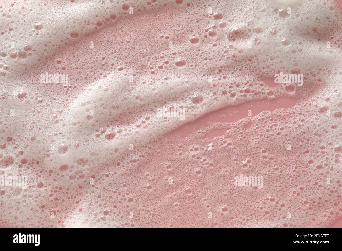 White washing foam on pale pink background, top view Stock Photo - Alamy