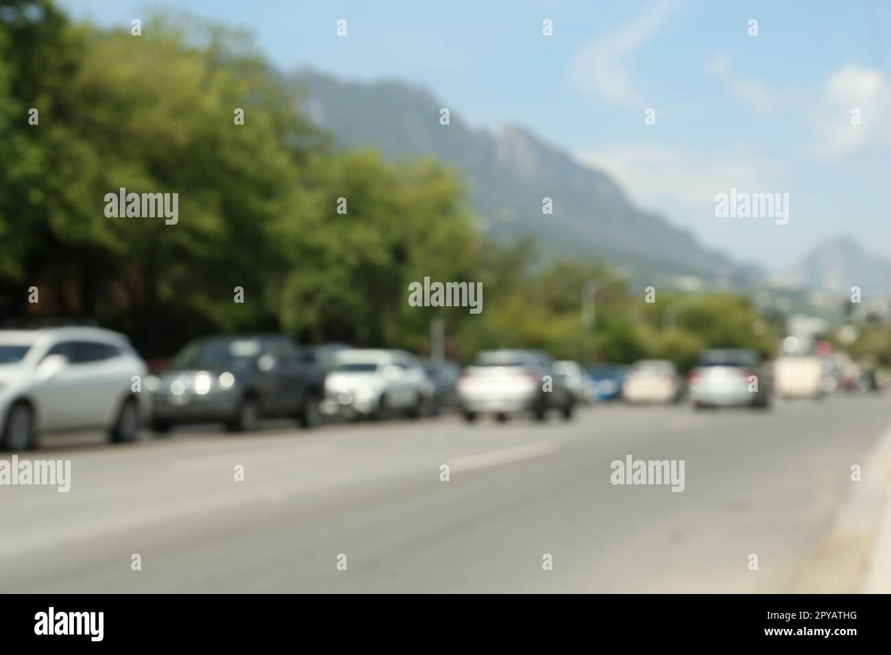 Blurred view of mountains and highway with cars Stock Photo - Alamy