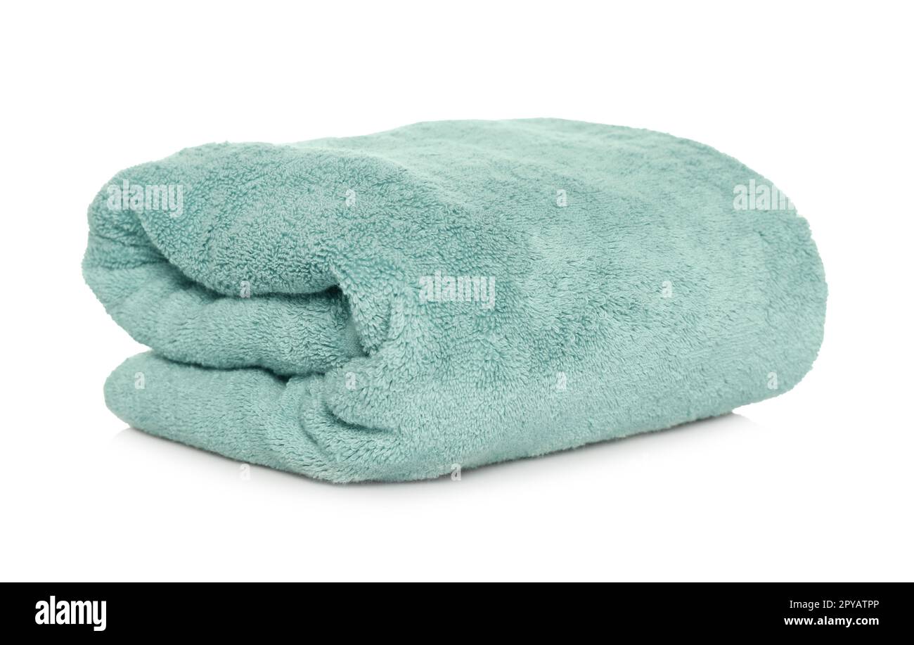 Folded soft terry towel on white background Stock Photo - Alamy