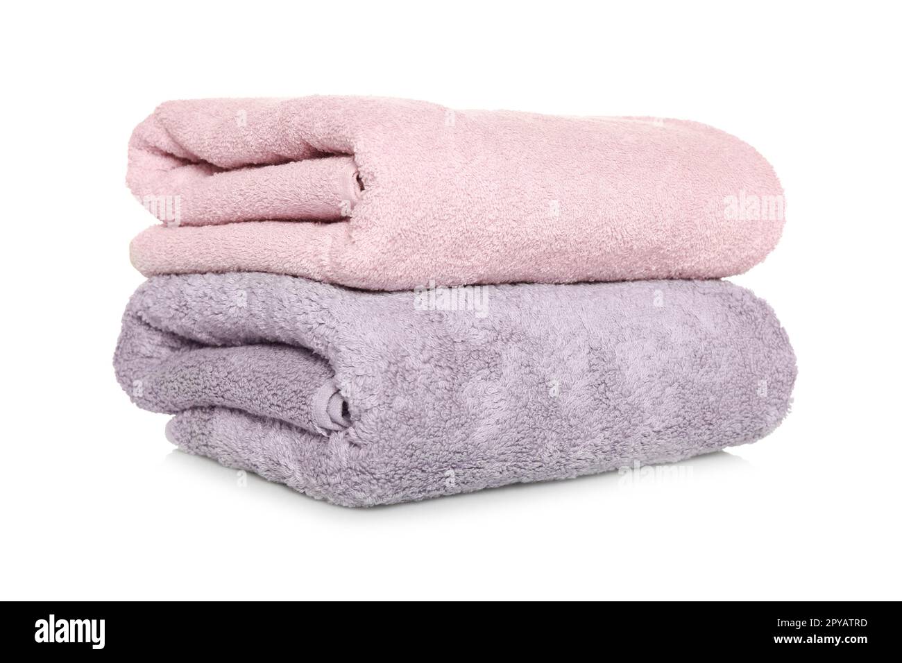 Folded soft terry towels on white background Stock Photo - Alamy
