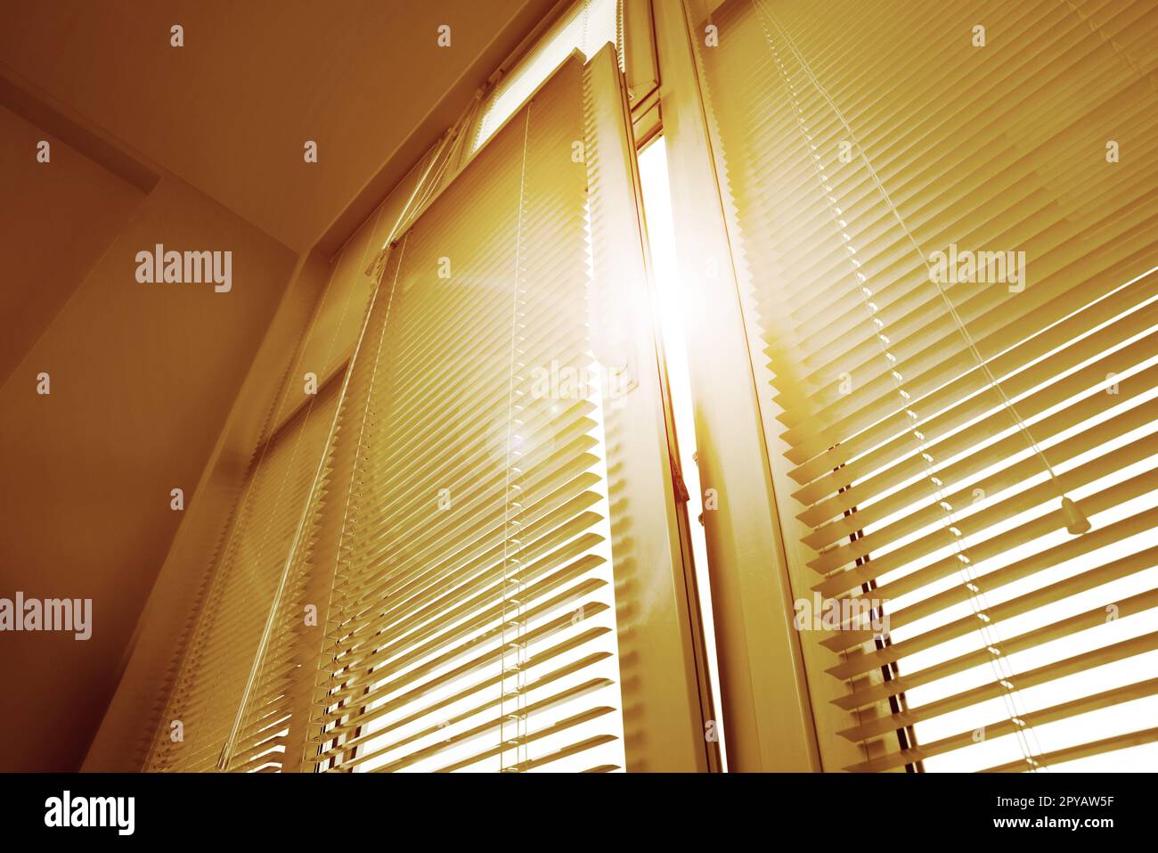 Stylish window with horizontal blinds in room, low angle view Stock ...