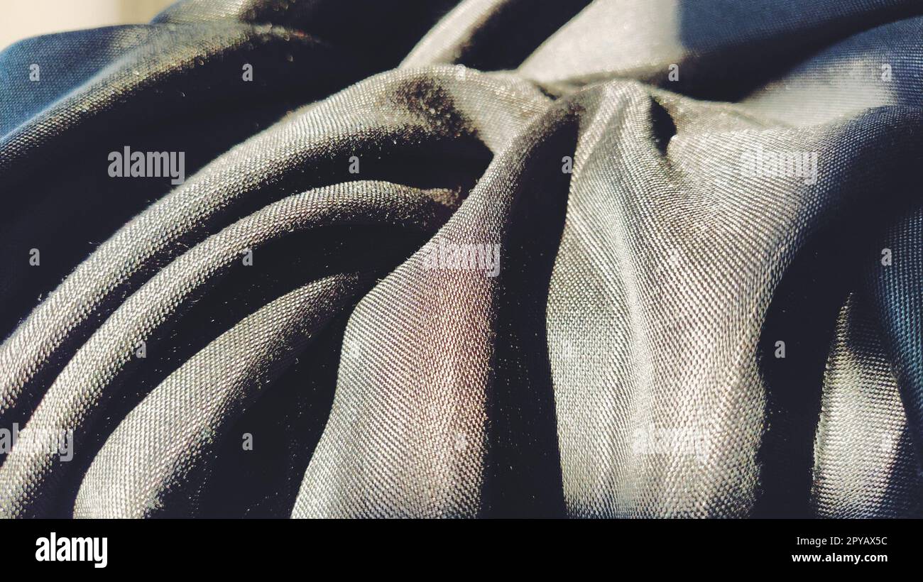 black fabric with interlacing threads close-up. Dark blue tint. Nice ...