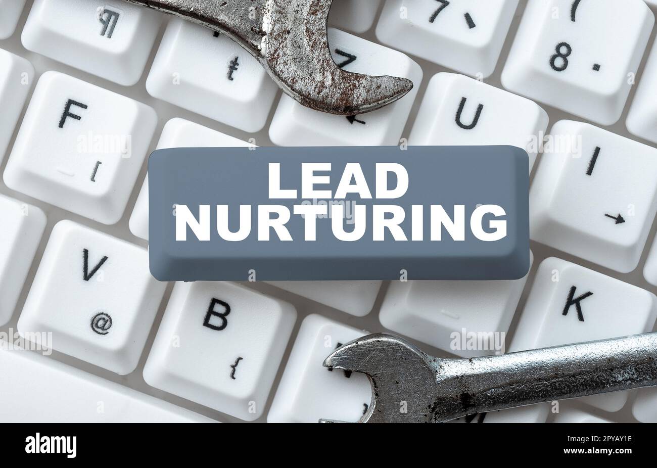 Hand writing sign Lead Nurturing. Word Written on method of building a ...