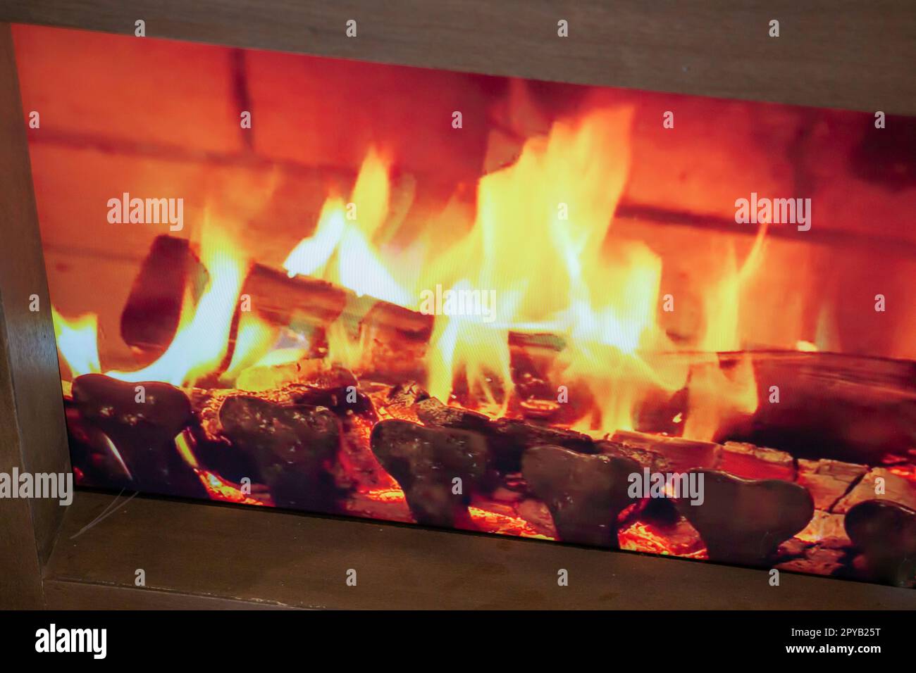 Fake fireplace is a Christmas decoration Stock Photo - Alamy