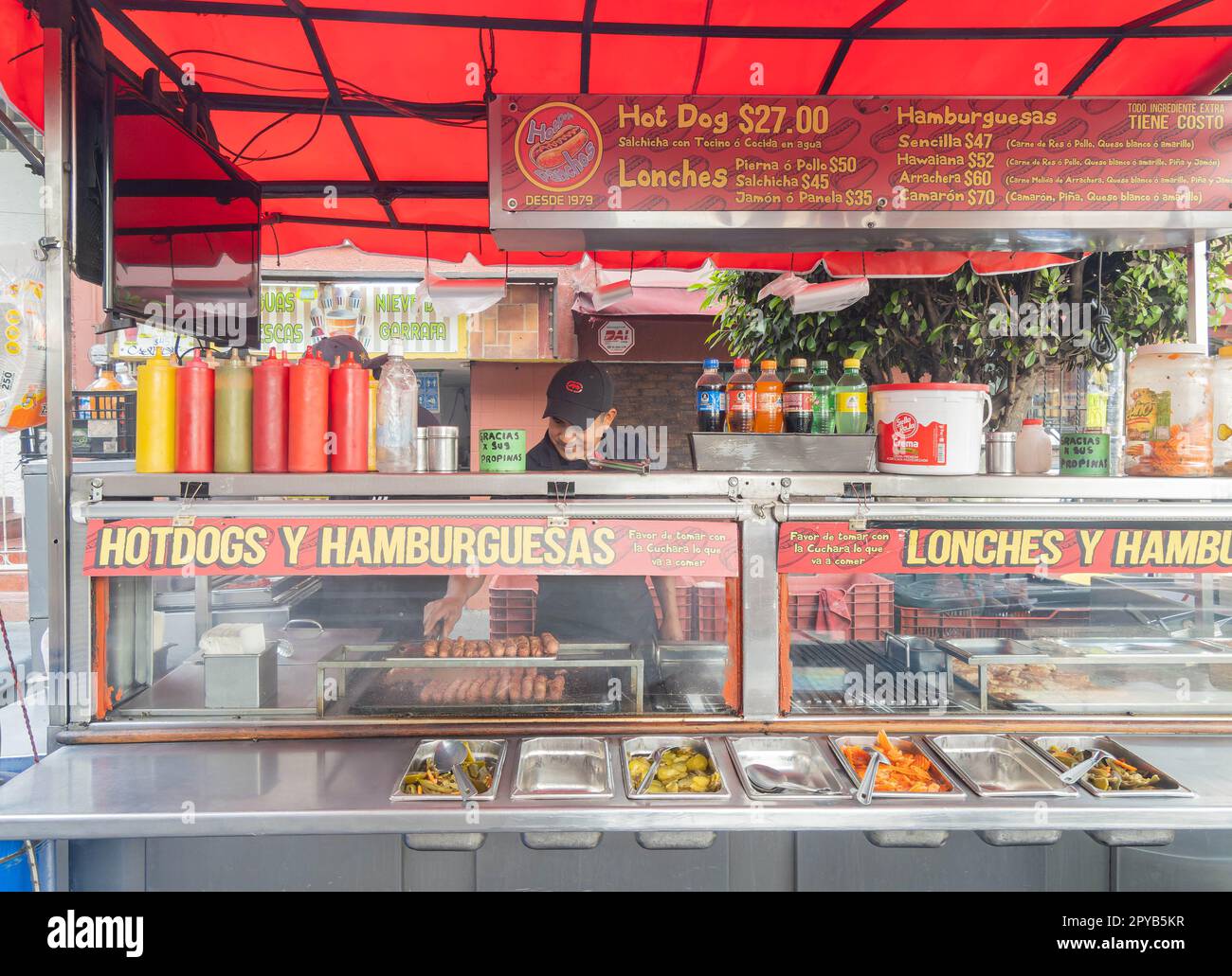 Mexico, APR 22 2023 - Hot dog street vendor selling foods Stock Photo ...