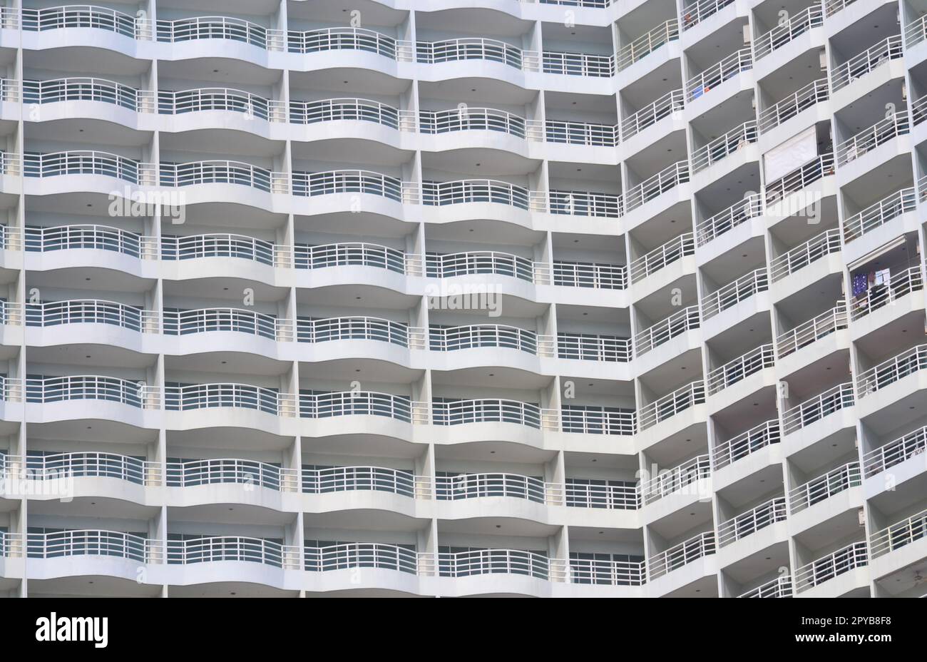 Multiple balconies make a pattern on a tower block or high rise ...