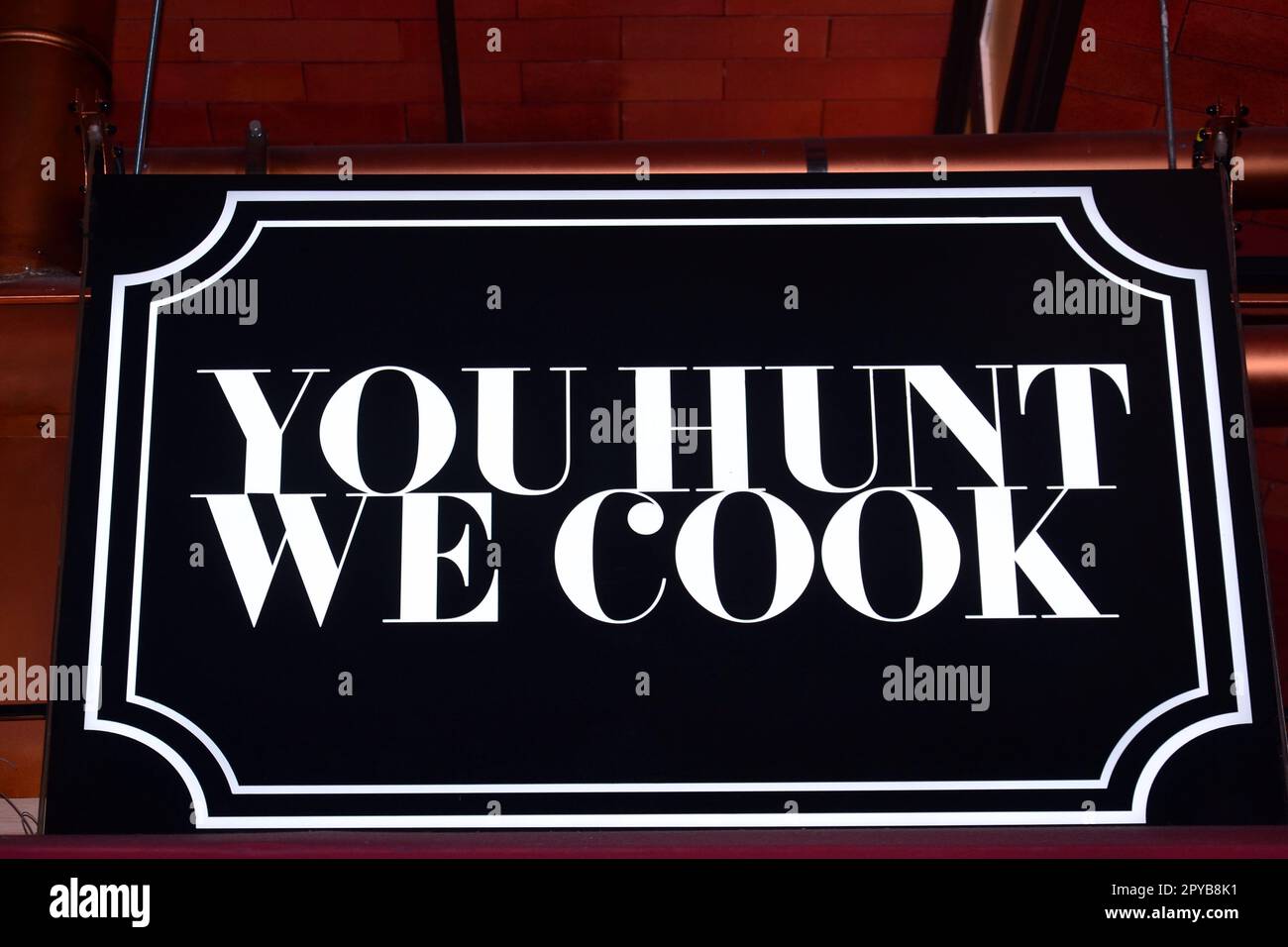 Sign, signage, notice: You hunt we cook' Stock Photo - Alamy