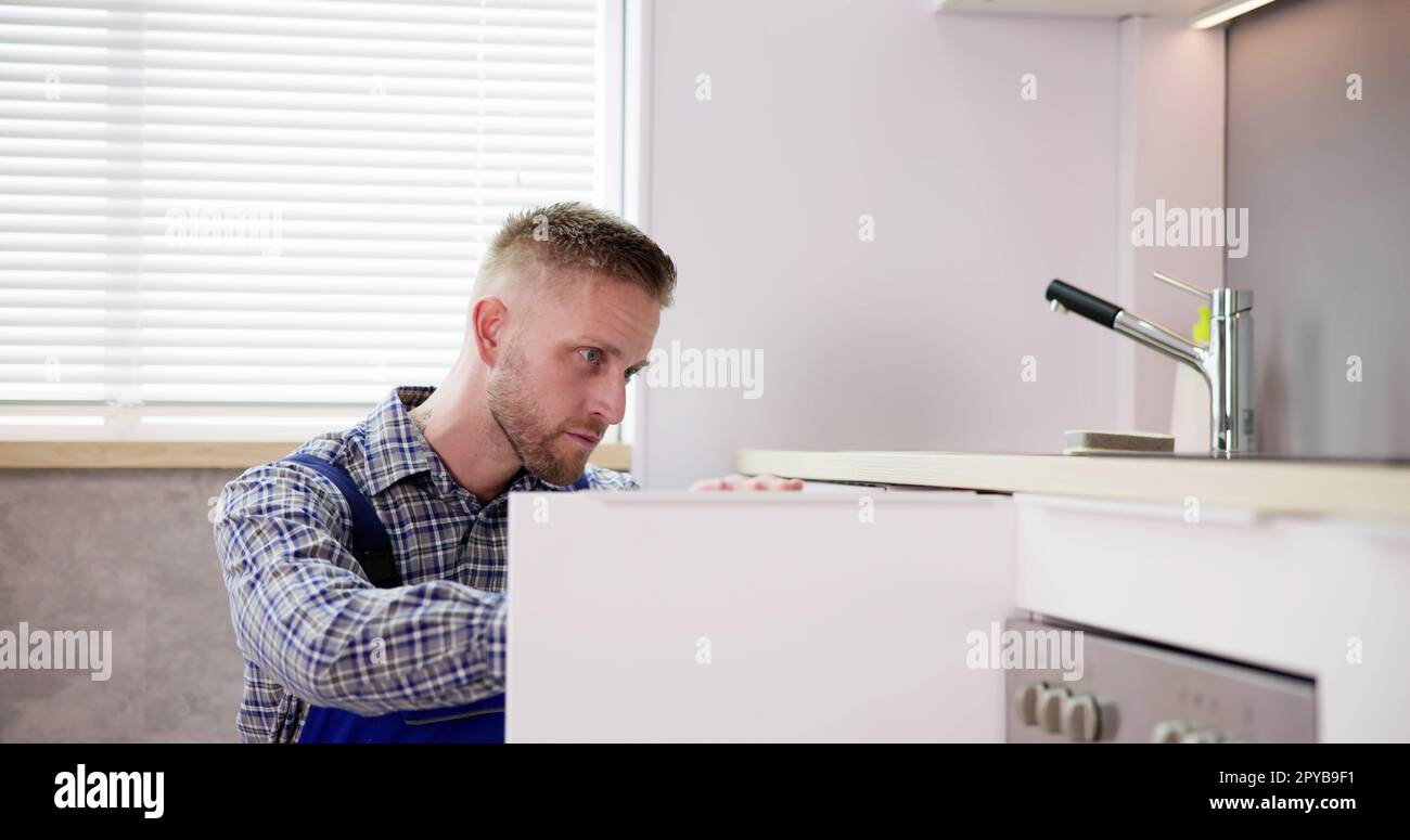 Home Kitchen Cabinet Repair And Maintenance Stock Photo - Alamy