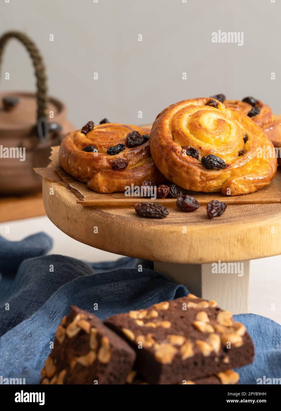 Breakfast pastries of cinnamon buns and chocolate brownies Stock Photo ...