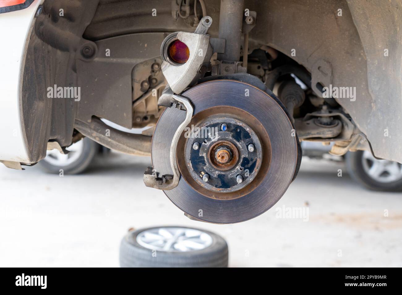 Car front disc break being checked and inspected for safety Stock Photo ...