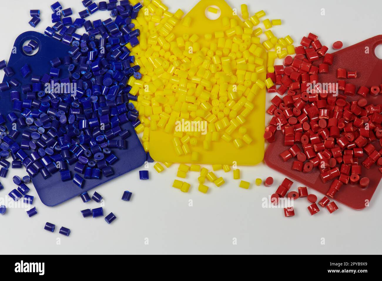 different colored plastic resins in test tubes in laboratory with color ...