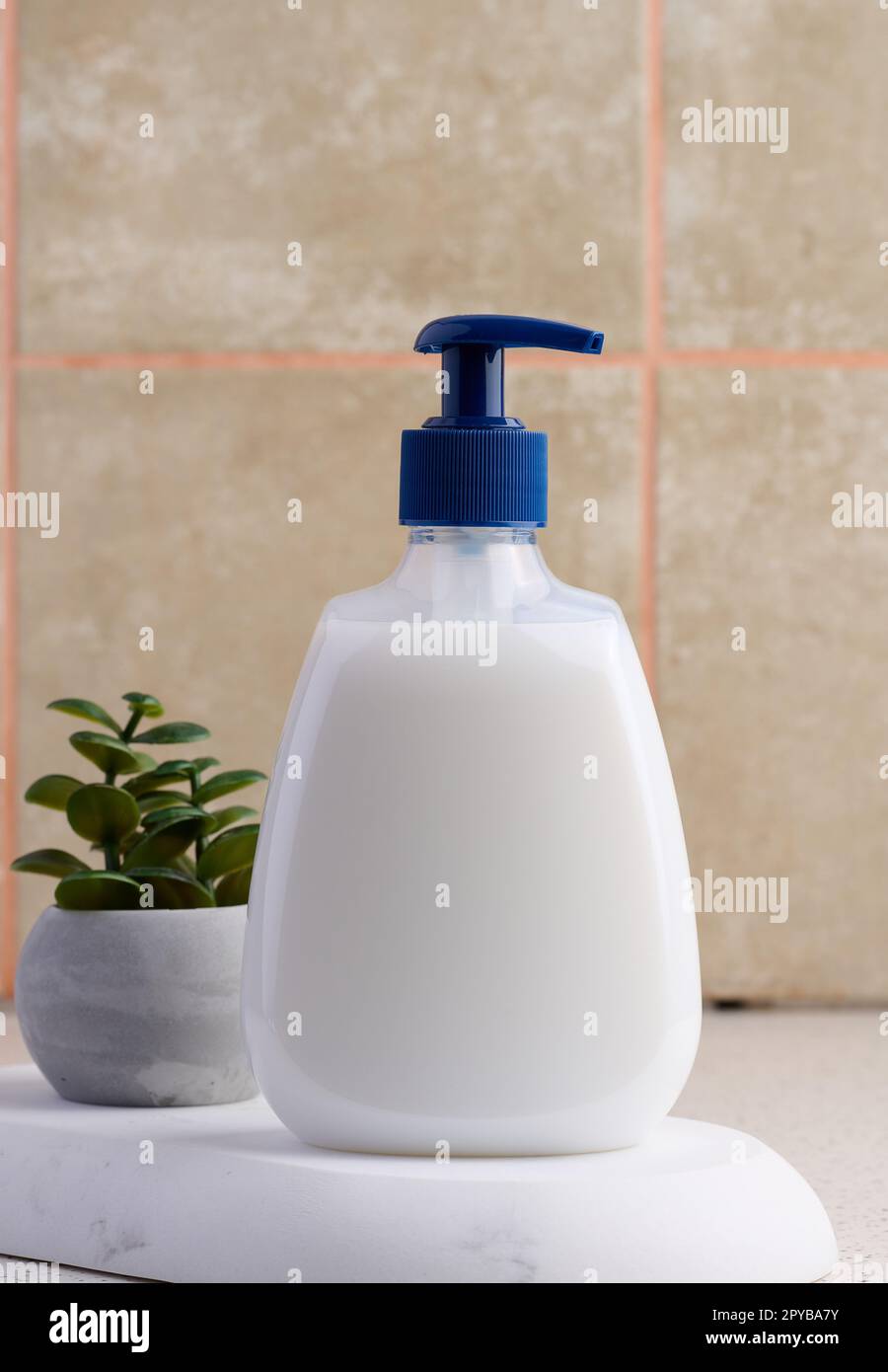 White plastic container with a pump for liquid products. Container for ...