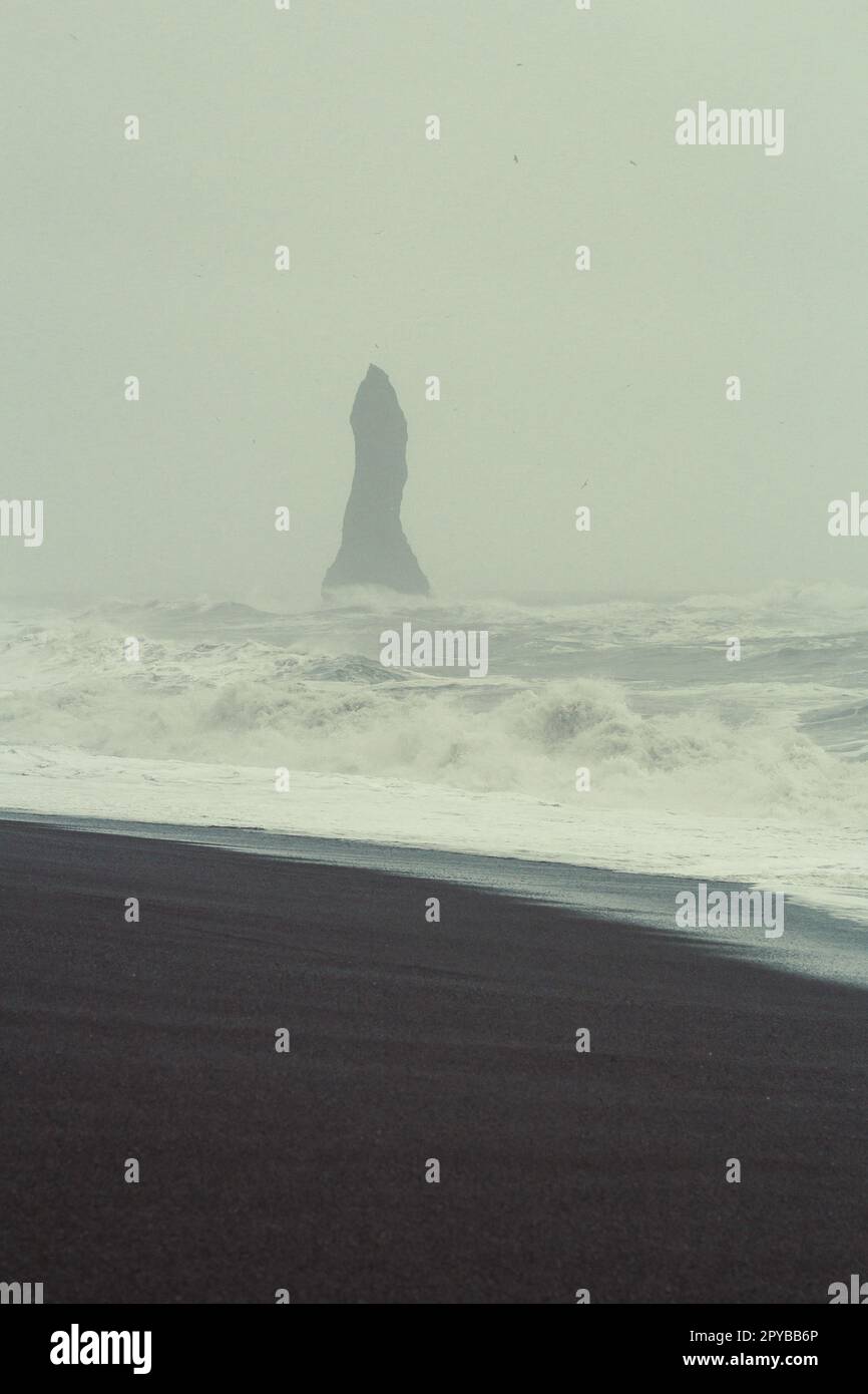 Basalt rock tower in ocean landscape photo Stock Photo - Alamy