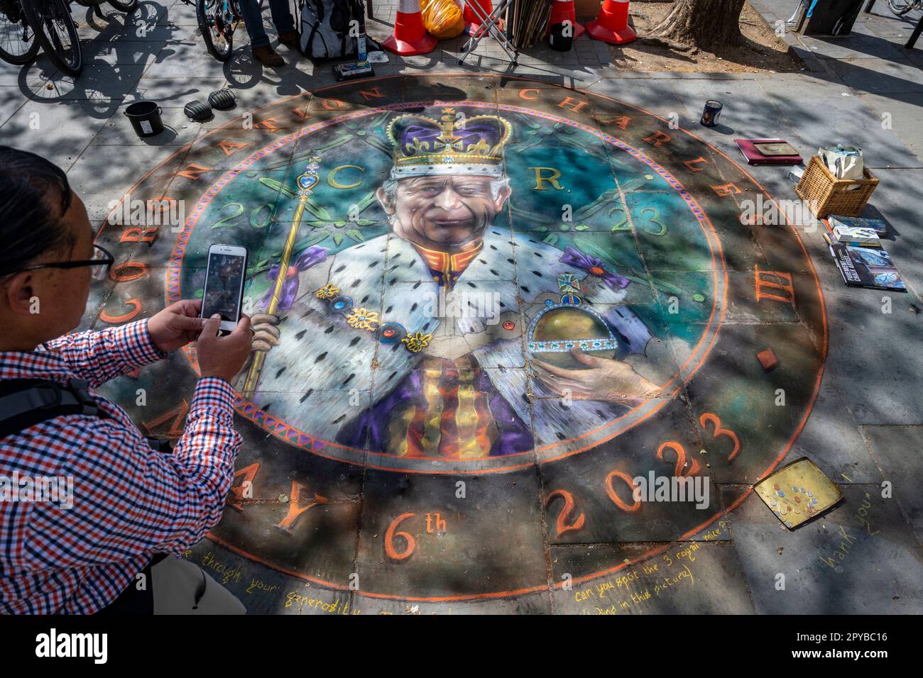 London, UK. 3 May 2023. A tourist views pavement chalk artist Julian ...