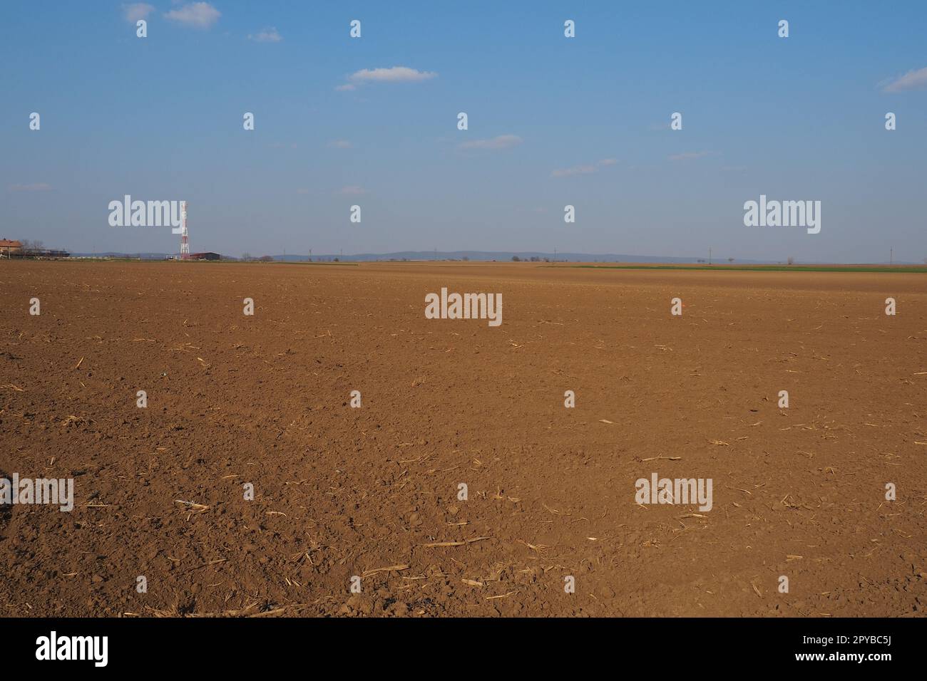 Arable field ready for spring agricultural work. Furrows from the ...