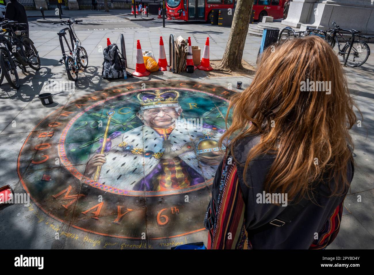 London, UK. 3 May 2023. A tourist views pavement chalk artist Julian ...