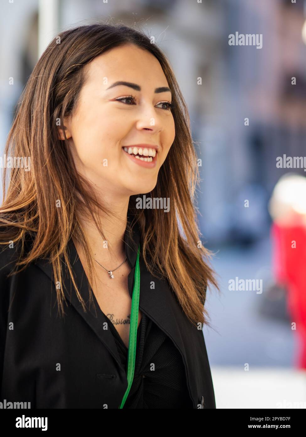 street portrait of long haired brunette standing mixed asian race ...