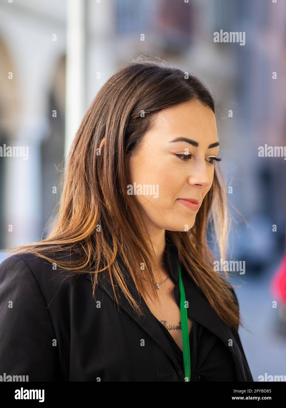street portrait of long haired brunette standing mixed asian race ...