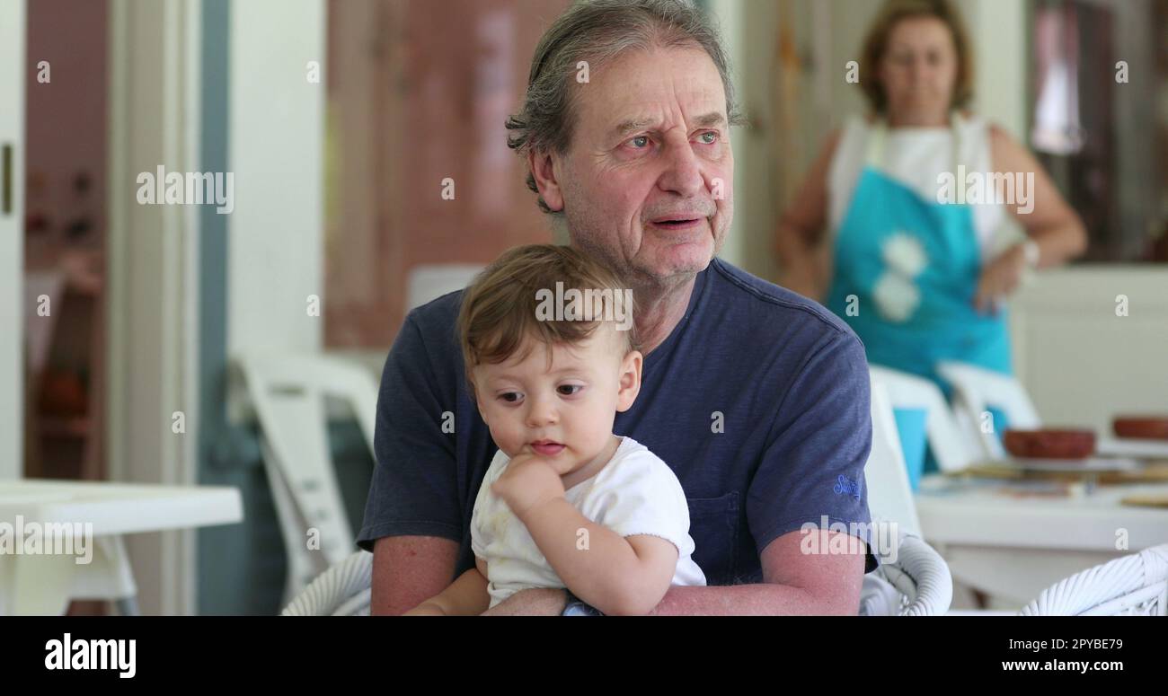 Real life grandpa with grand-child together interaction Stock Photo - Alamy