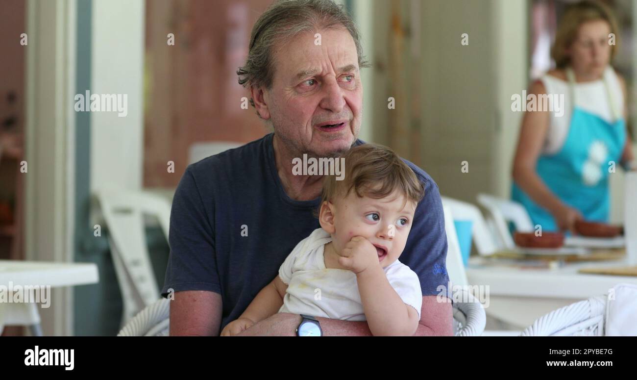 Real life grandpa with grand-child together interaction Stock Photo - Alamy
