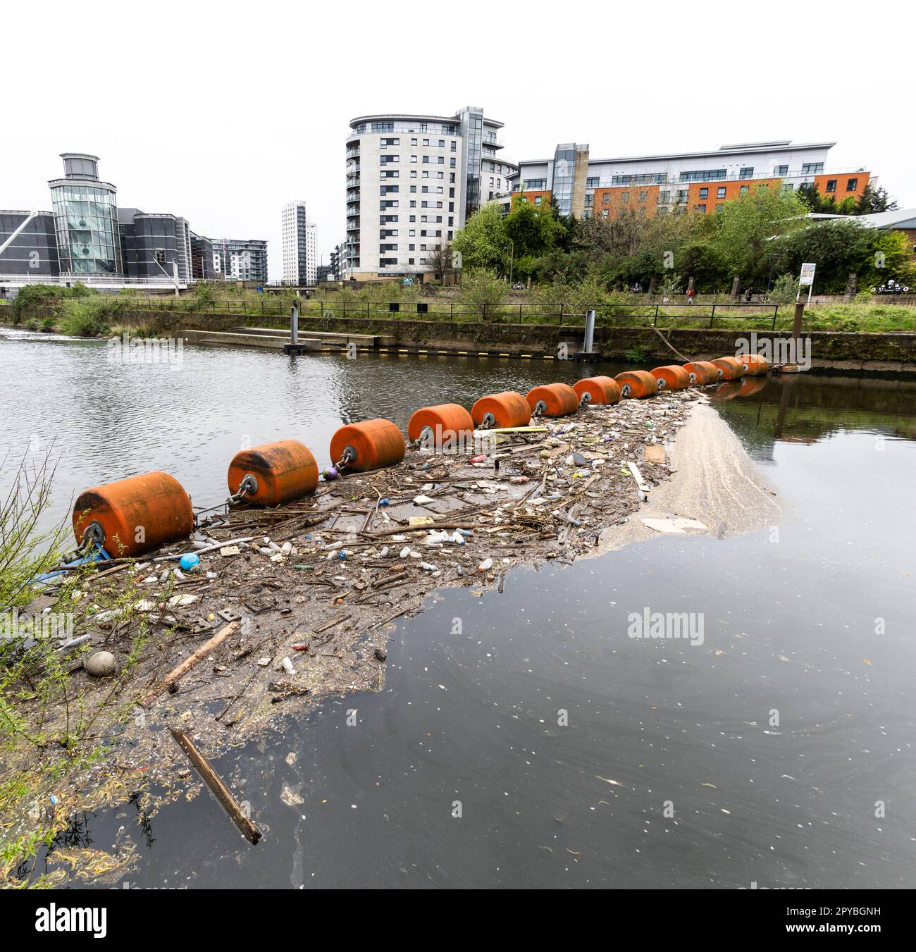 A floating boom chain strung across the River Aire at Leeds Dock in ...