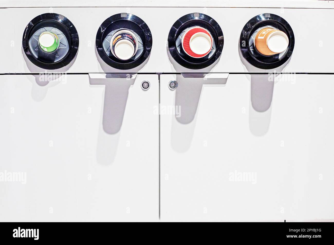 paper cups in a vending machine with various drinks Stock Photo - Alamy