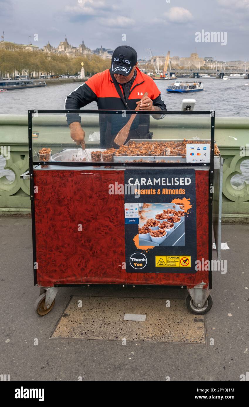 Food Vendor on Westminster Bridge London UK selling caramelised peanuts ...