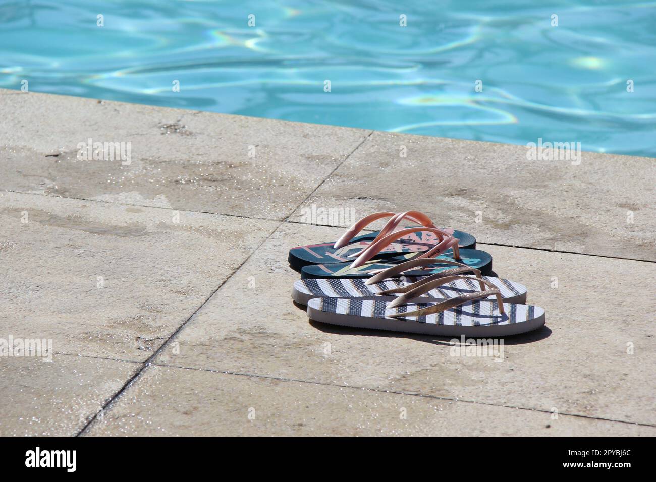 flip flops by pool Stock Photo - Alamy