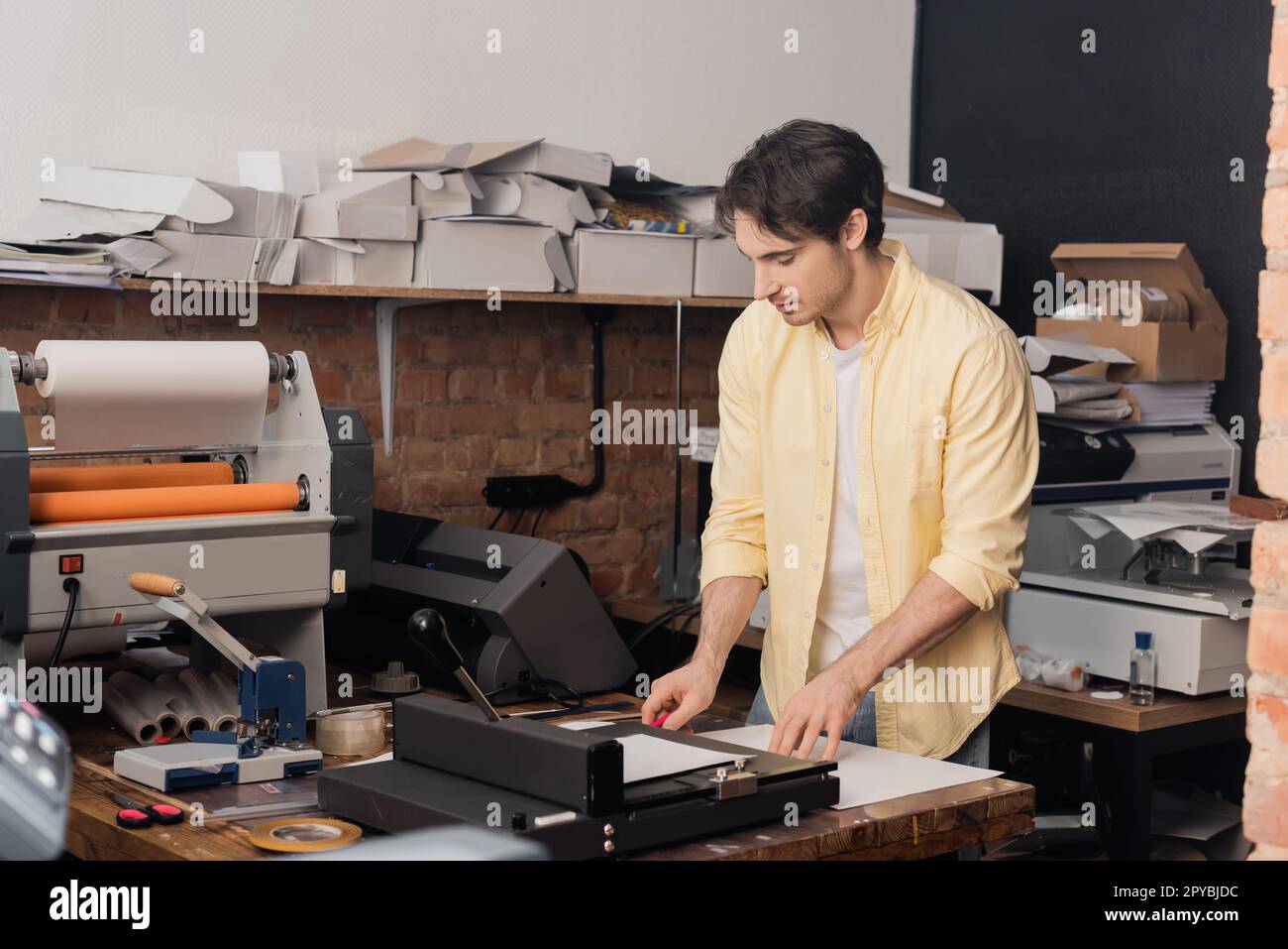 Image handsome man cutting paper hi-res stock photography and images ...