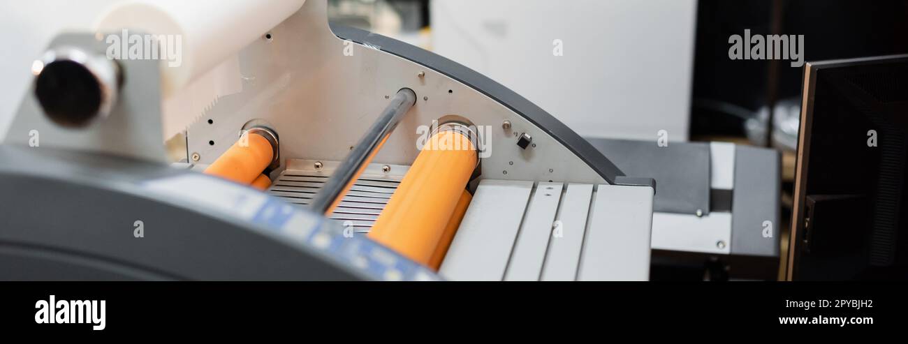 professional print plotter with paper roll in print center, banner ...