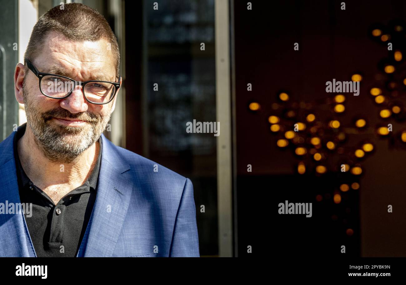 THE HAGUE - Theo Maassen leaves after the memorial service for Paul van ...