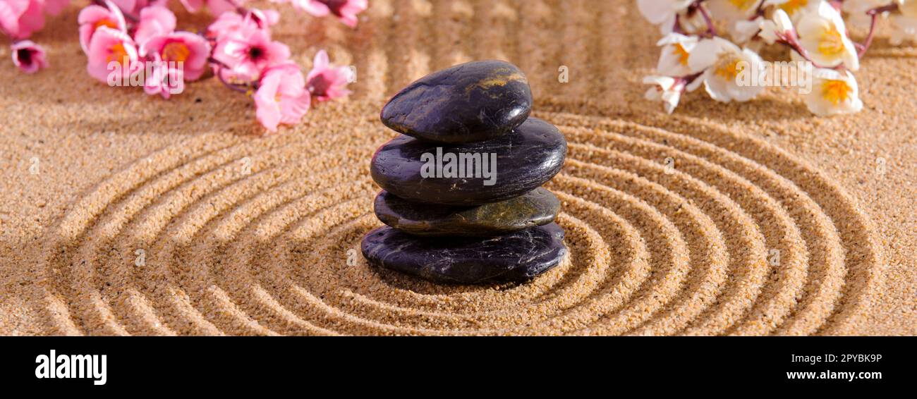 Japanese Zen garden with stone in textured sand Stock Photo - Alamy