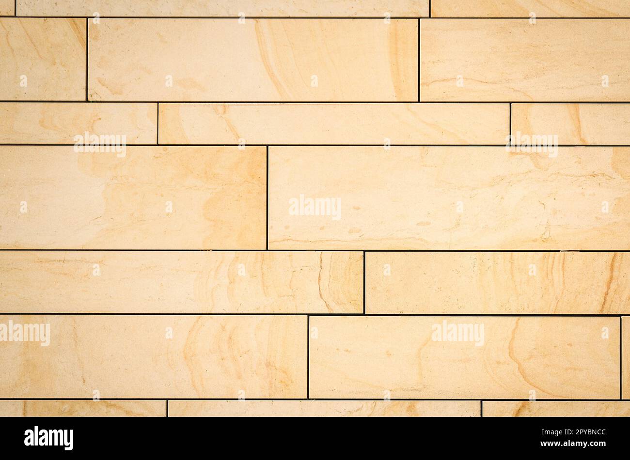 Building wall made of ceramic tiles. Beige tiles wall background or ...