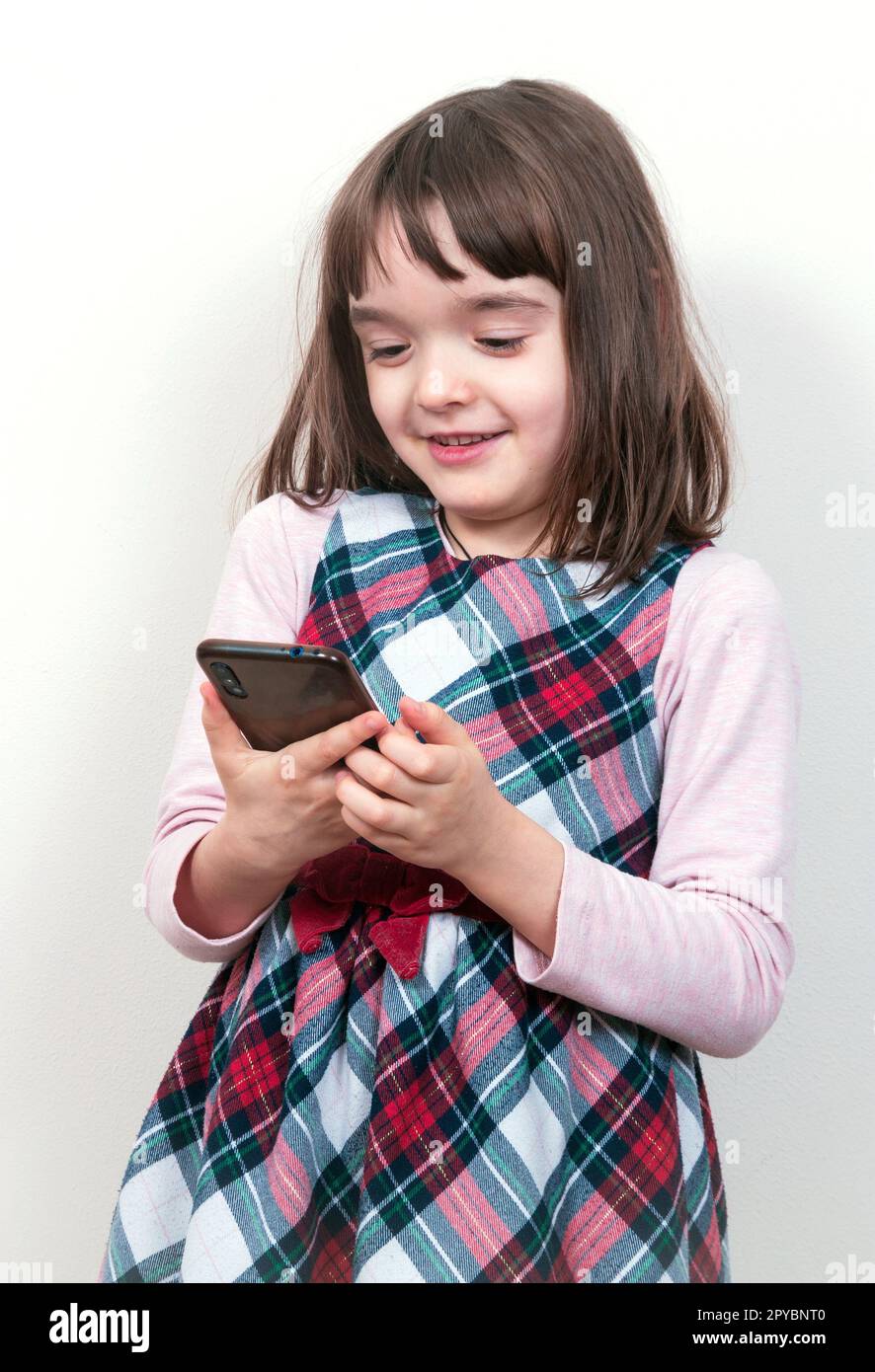 Little child girl with the phone Stock Photo - Alamy